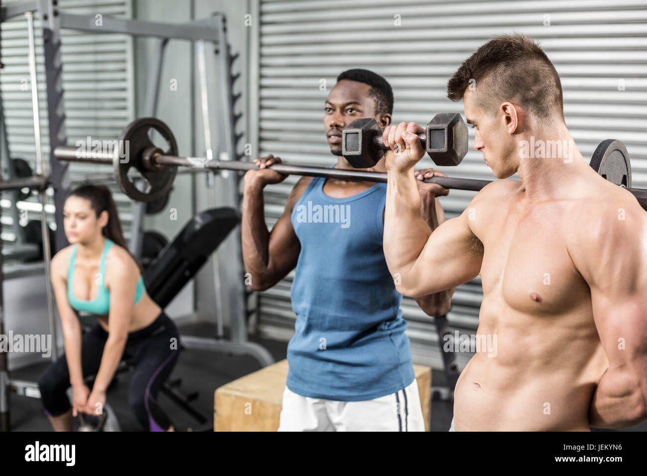 Fit people exercising together Stock Photo - Alamy