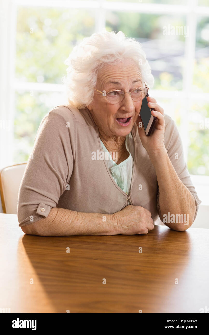 Elderly woman phone calling Stock Photo - Alamy