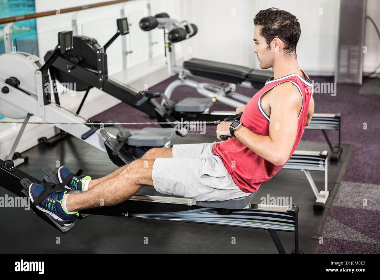 Male on rowing machine hi-res stock photography and images - Alamy