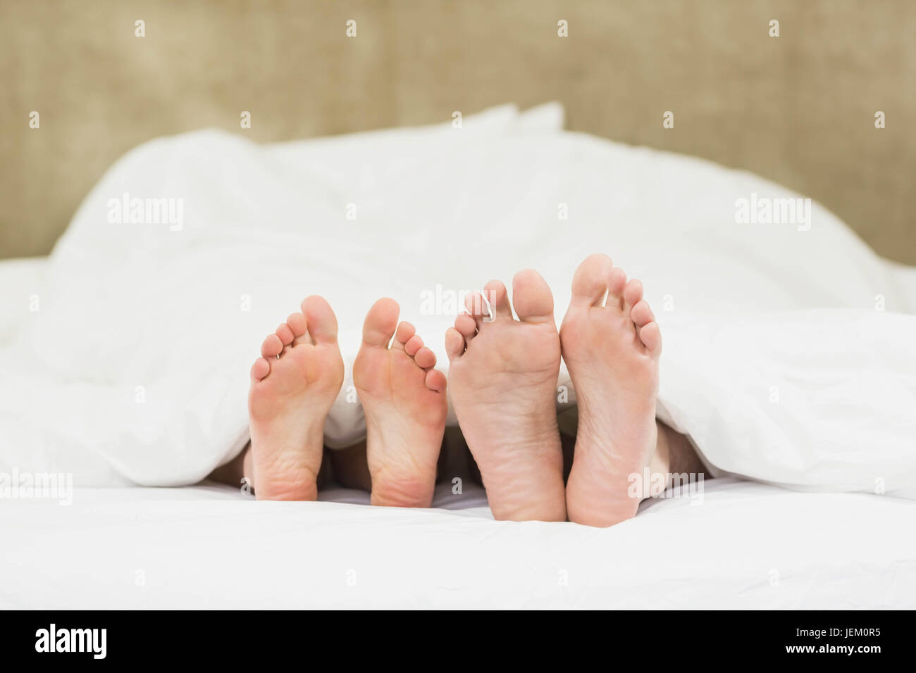 Mature couple feet bed hi-res stock photography and images - Alamy