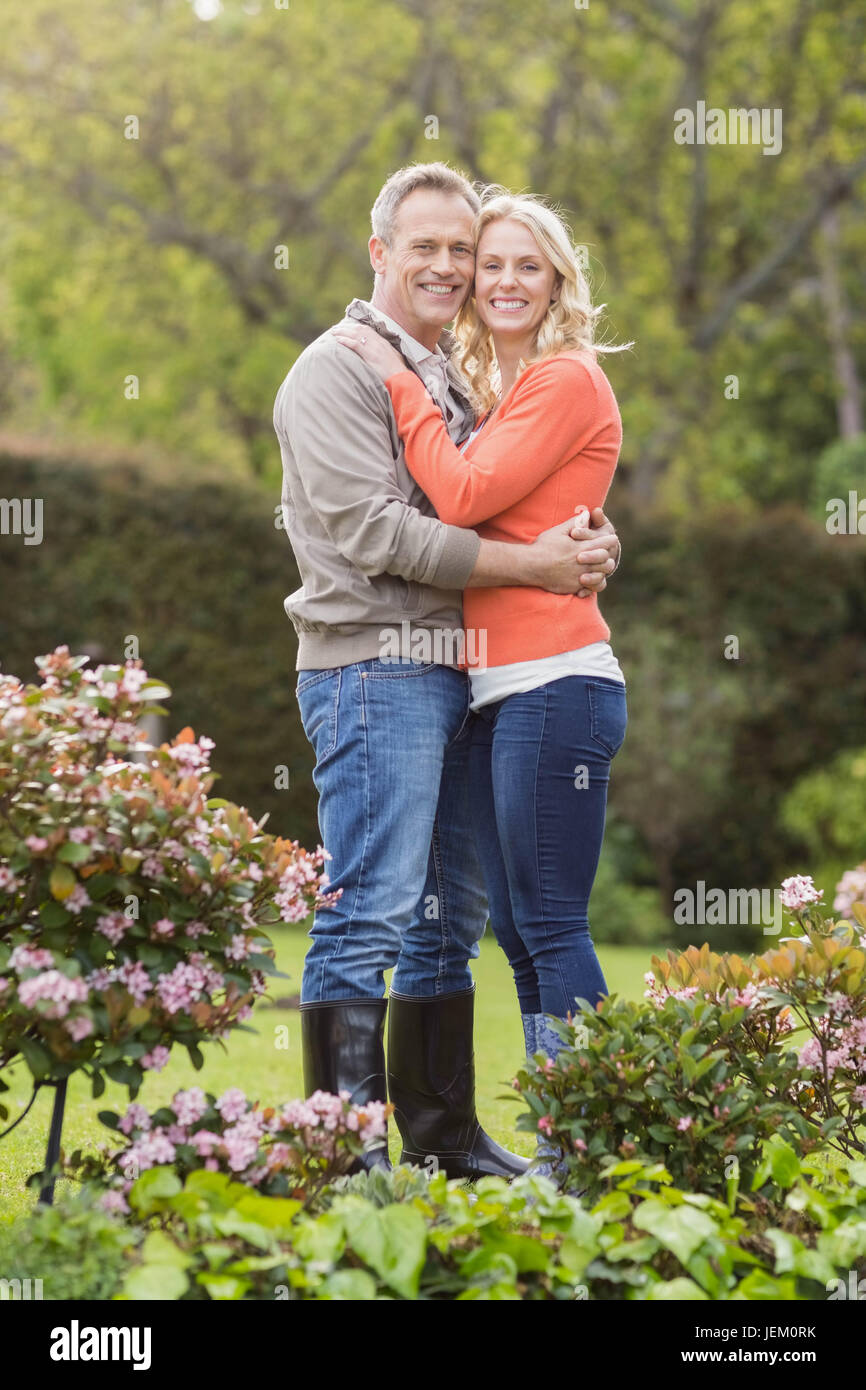 Portrait of cute couple hugging Stock Photo - Alamy