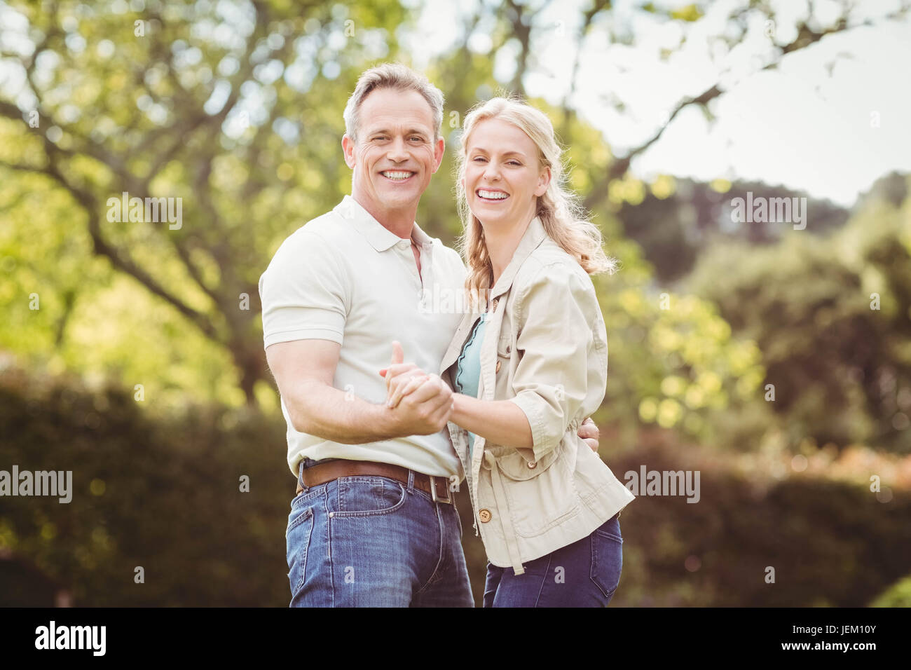 Cute couple hugging Stock Photo - Alamy