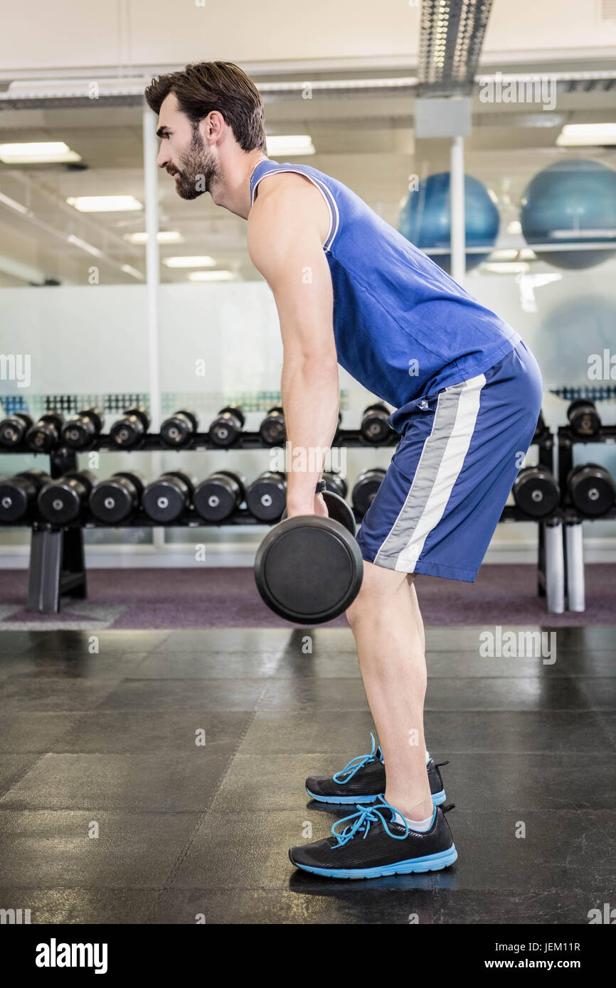 Muscular man lifting barbell Stock Photo - Alamy
