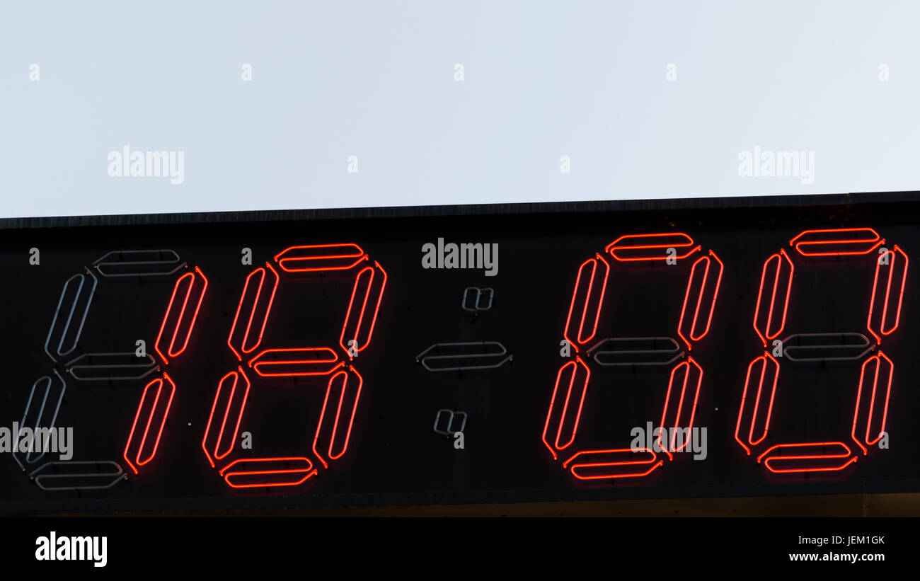 Electronic clock with red illumination and the time 18:00 Stock Photo ...