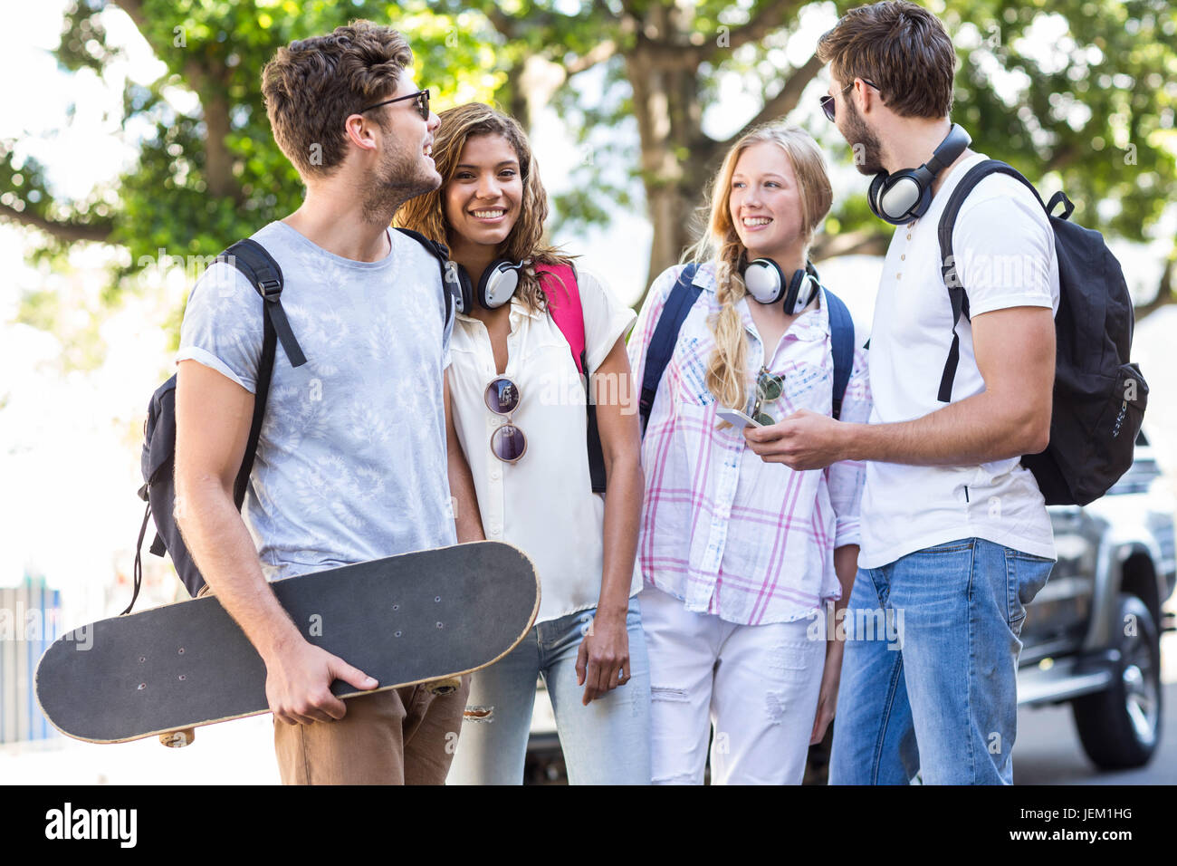 Hip friends spending time together Stock Photo - Alamy