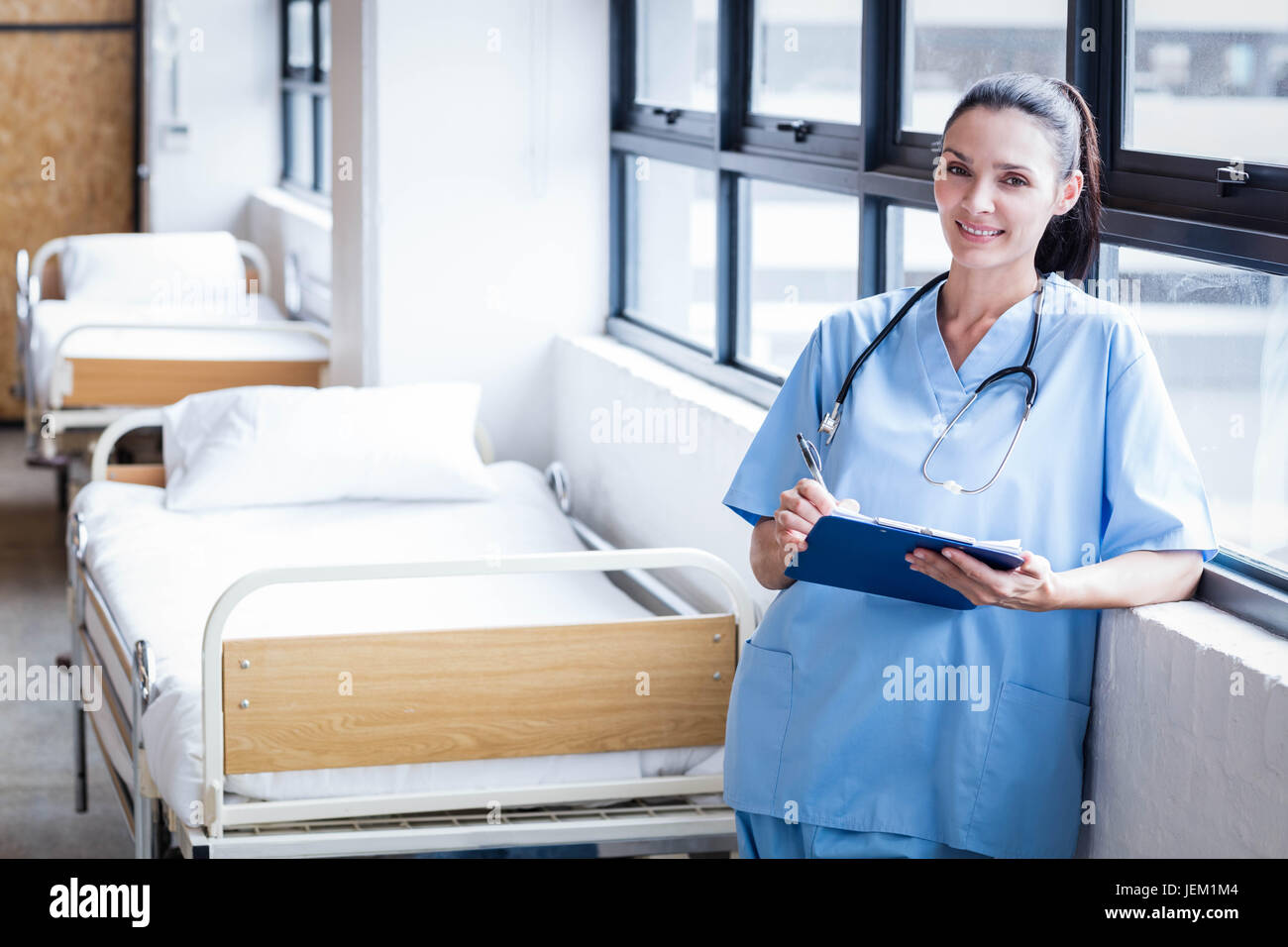 Nurse smiling at the camera Stock Photo - Alamy