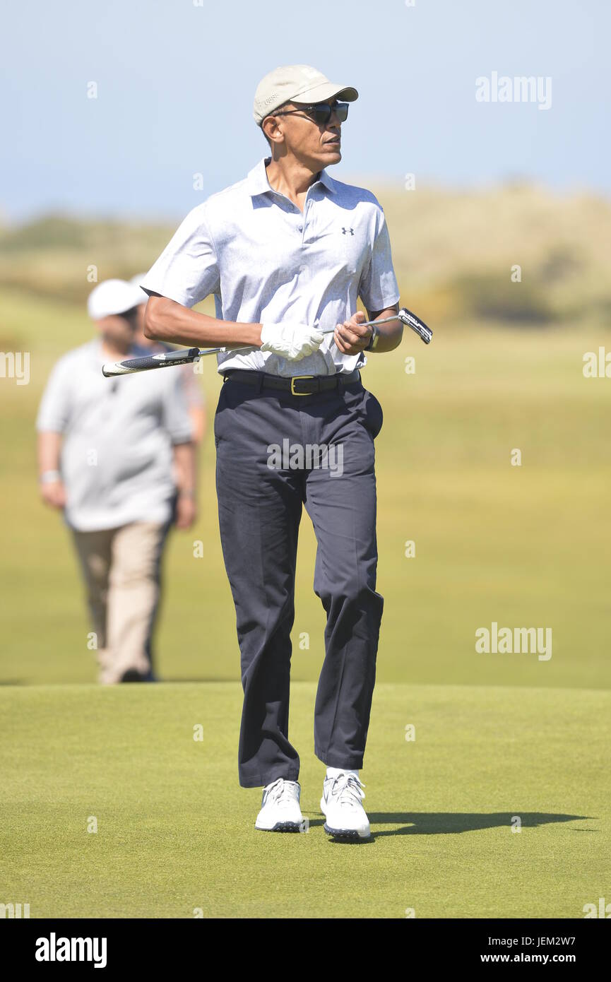 Former US president Barack Obama (light blue shirt) playing a round of ...