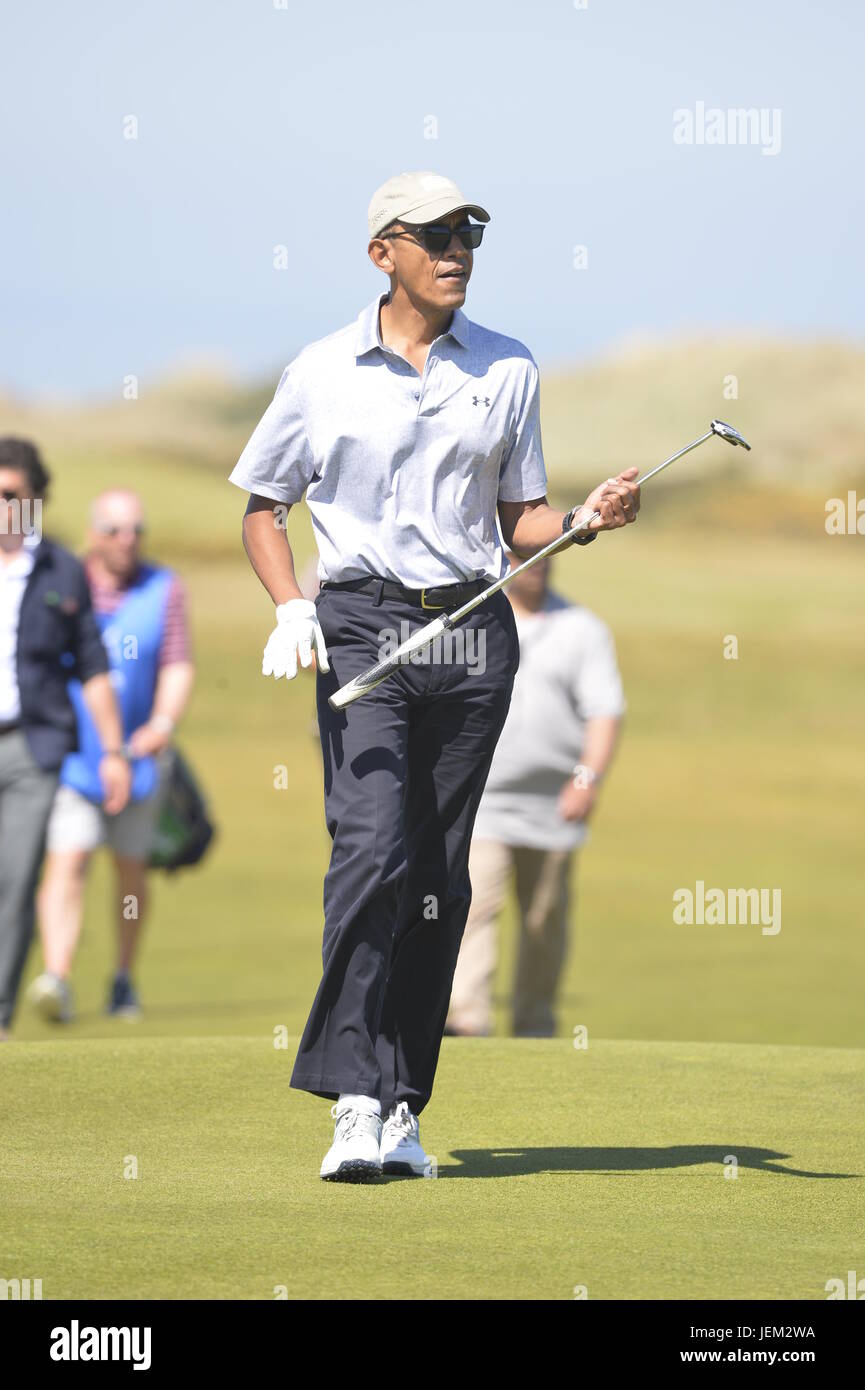 Former US president Barack Obama (light blue shirt) playing a round of ...