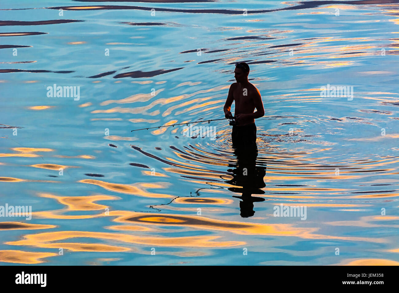 Reflection silhouette ripple hi-res stock photography and images - Alamy