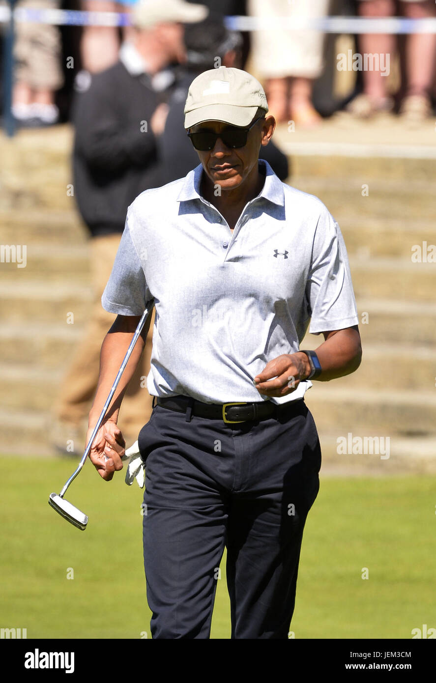 Former U.S. president Barack Obama (light blue shirt) playing a round ...