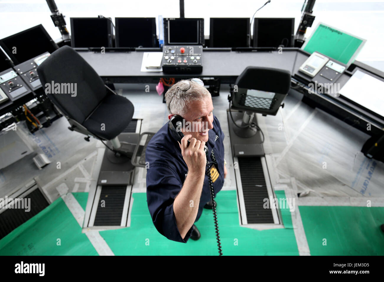 Commander Air Mark Deller makes final preparations in the flight ...