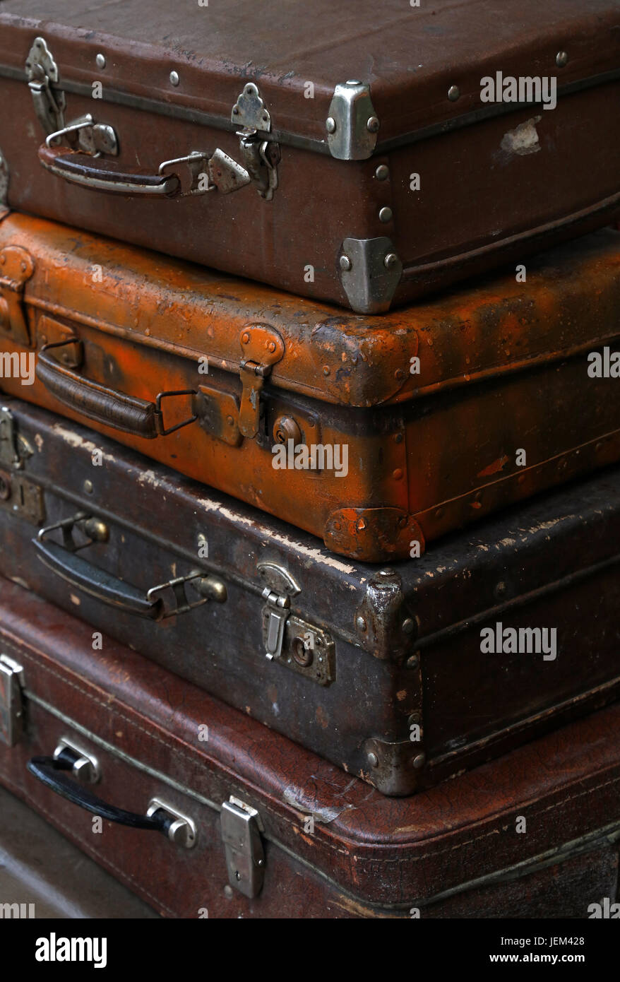Stack of four old vintage antique grunge travel luggage brown leather ...