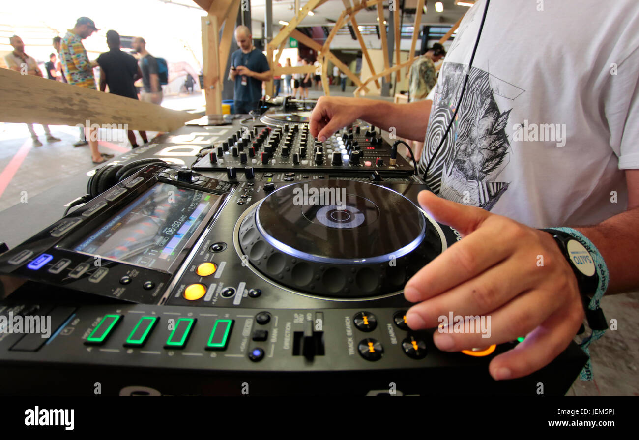 Deejay using music gear Stock Photo - Alamy