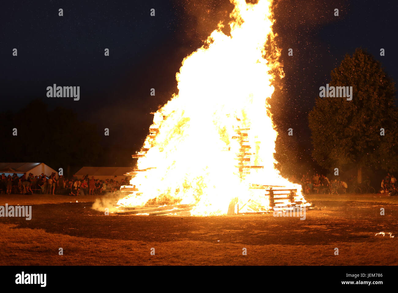 Midsummer celebration with big bonfire Stock Photo - Alamy