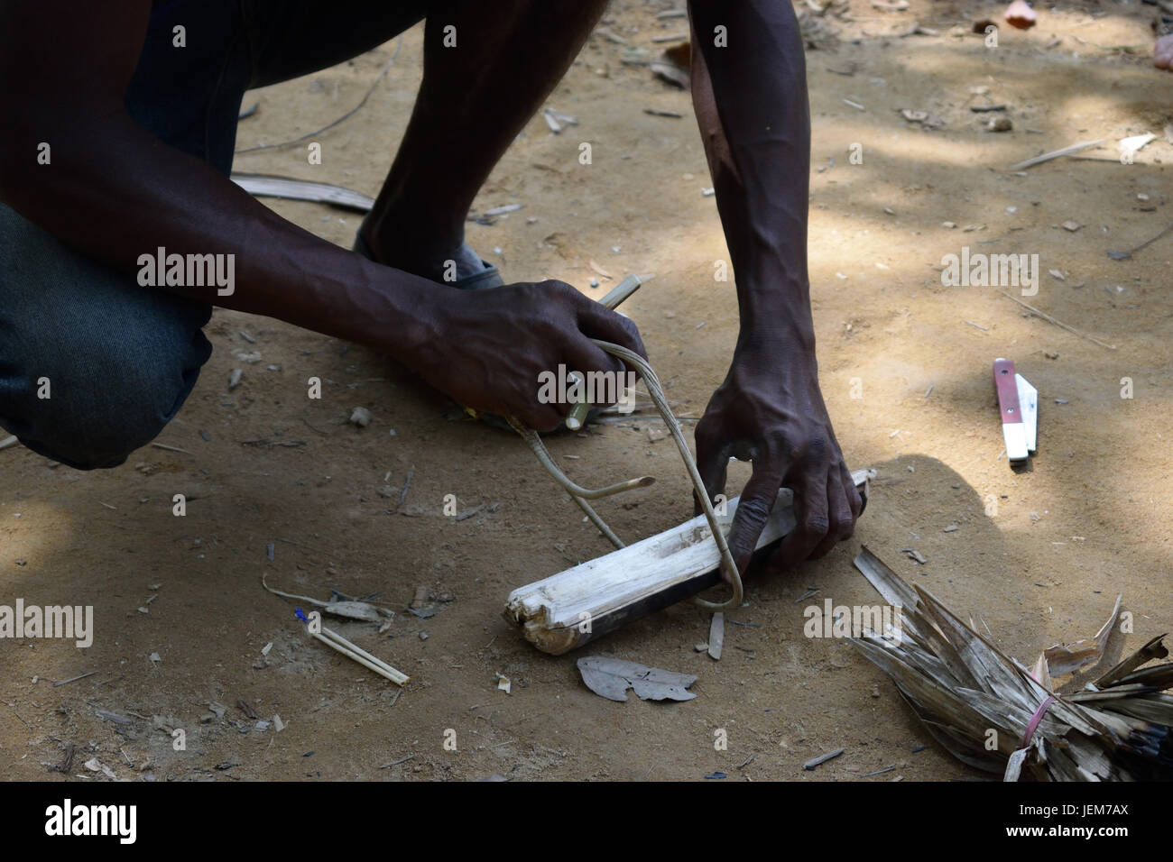 Man starting a fire Stock Photo - Alamy
