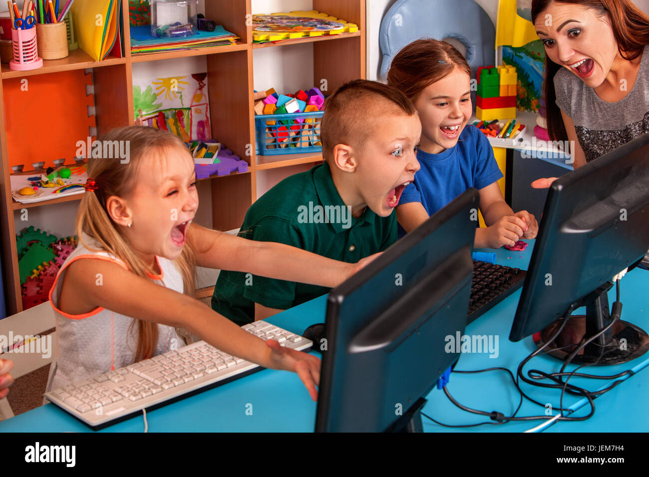 Children computer class us for education and video game Stock Photo - Alamy