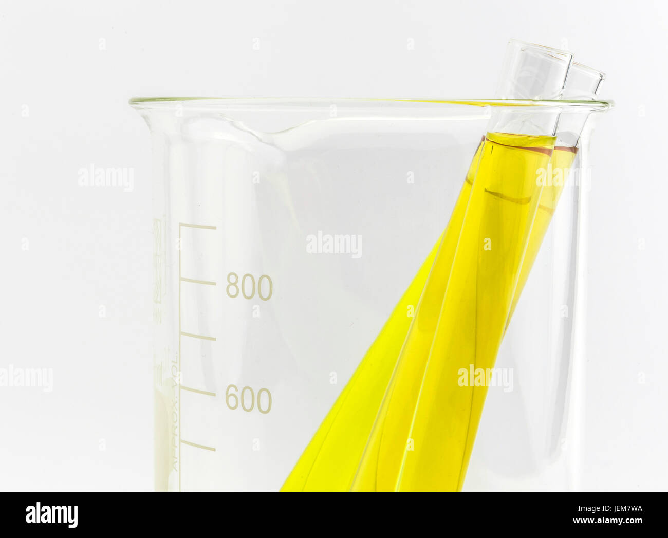 Test tube with yellow liquid (fluid, water) in the beaker for chemical ...