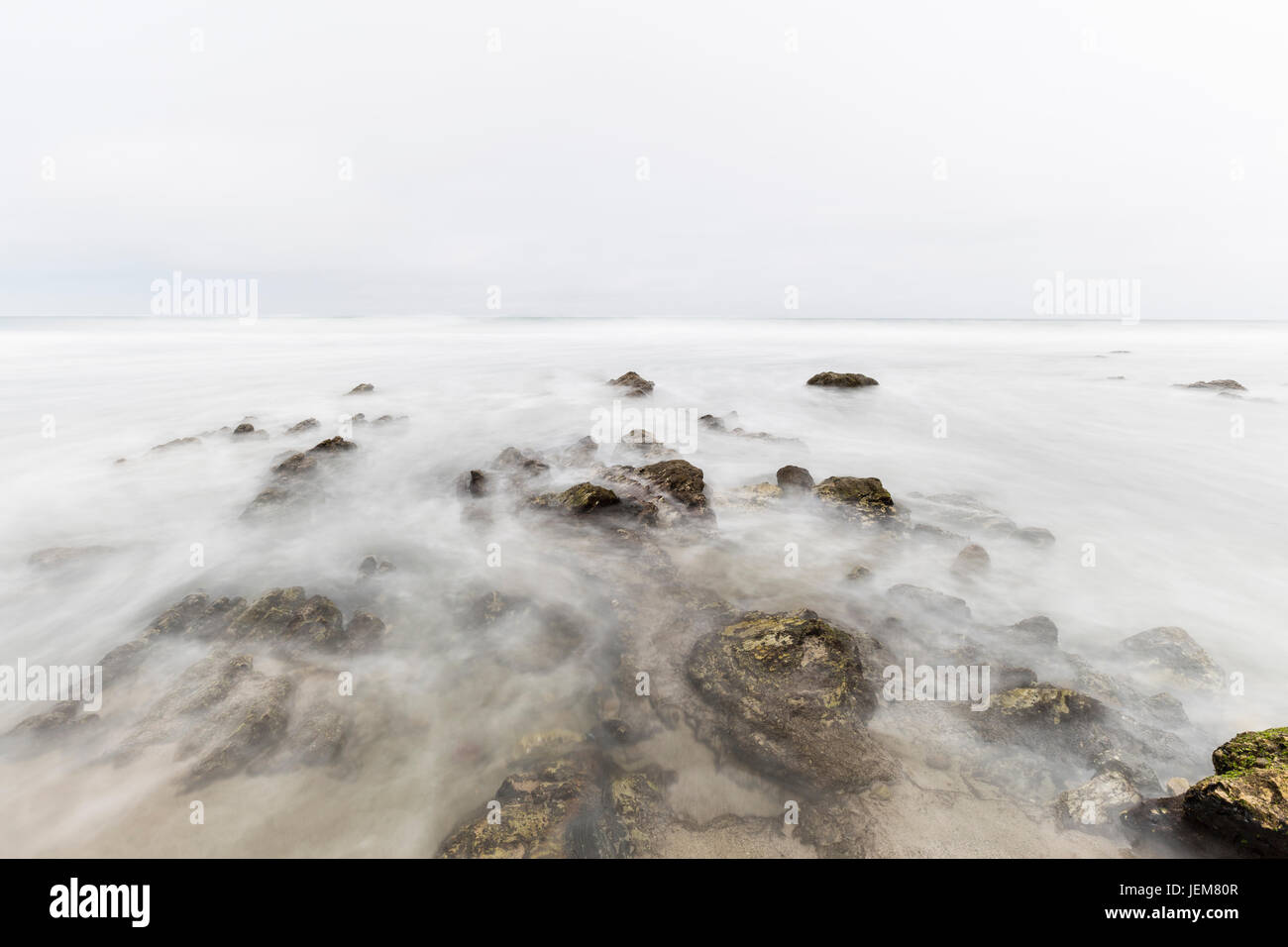 Foggy pacific ocean tidal pool with motion blur at Point Dume in Malibu ...