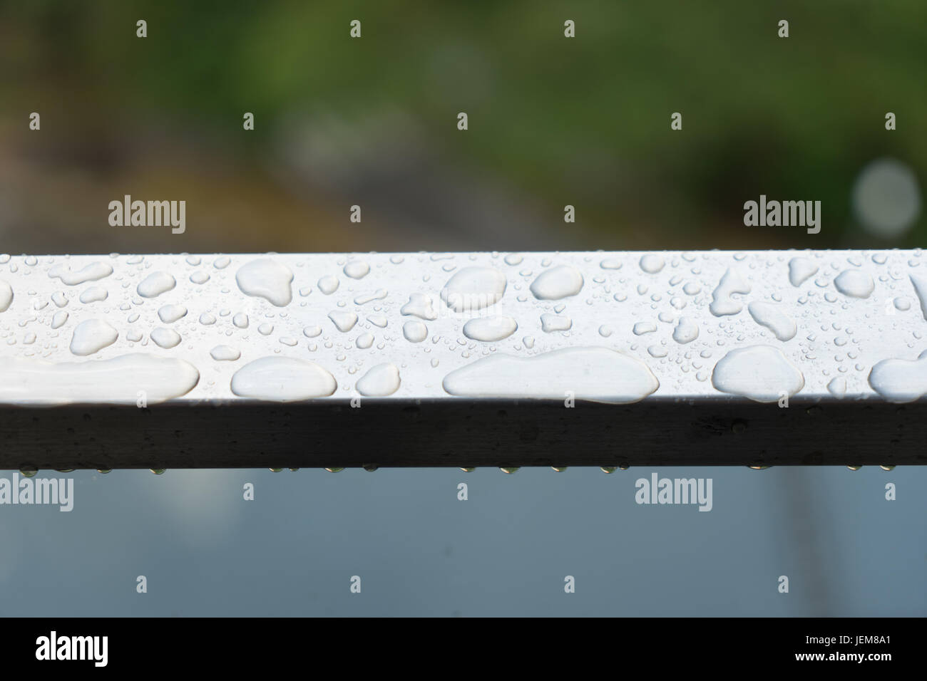 Rain drops on glass balcony, rainy day abstract background Stock Photo ...