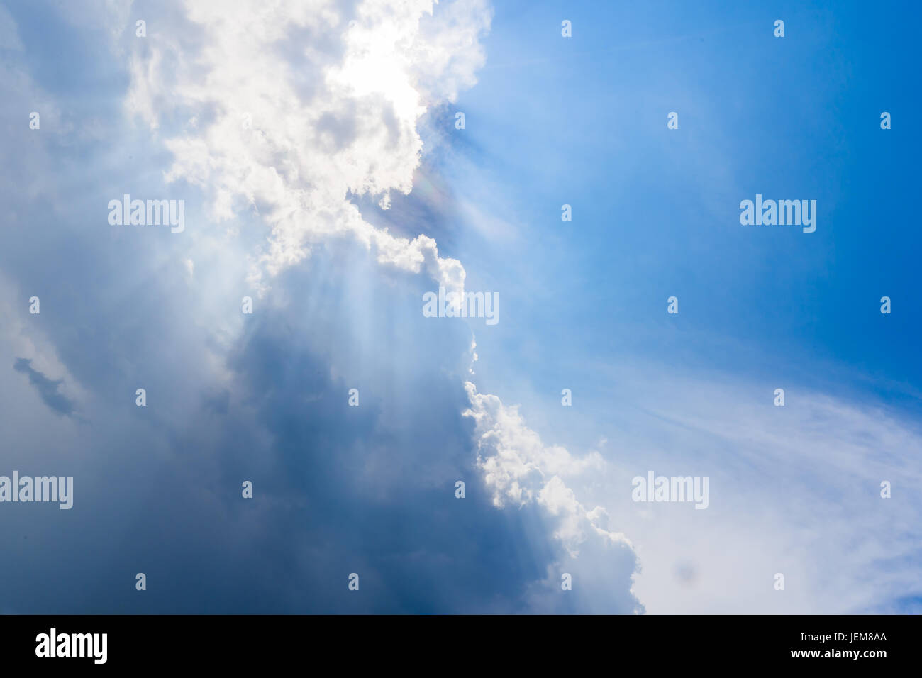 Sun rays through the clouds, Beautiful blue sky with clouds and rays of ...