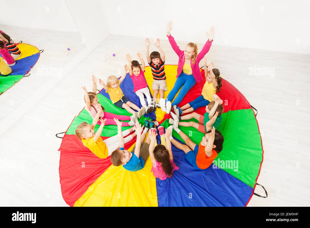 Kids and animator having fun playing circle games Stock Photo - Alamy