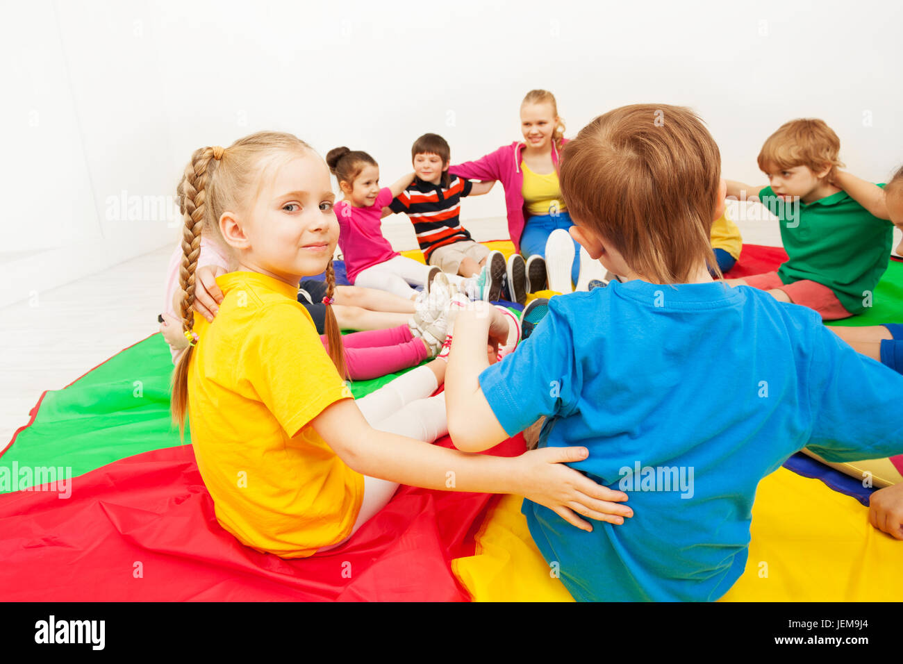 Group of children playing circle games hi-res stock photography and ...