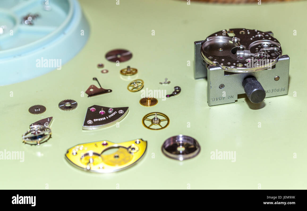 Watch repairer working with watch pieces Stock Photo - Alamy