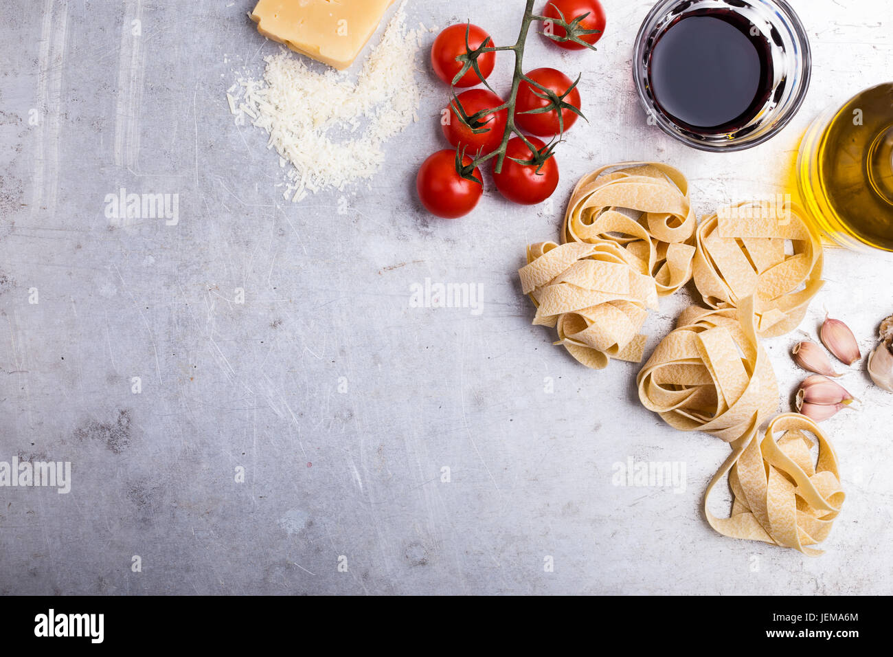 Italian cuisine cooking ingredients on light grey background with copy ...