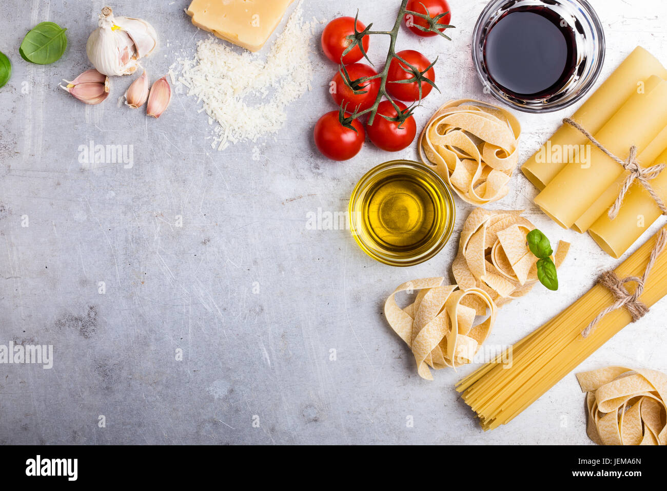 Italian cuisine cooking ingredients on light grey background with copy ...