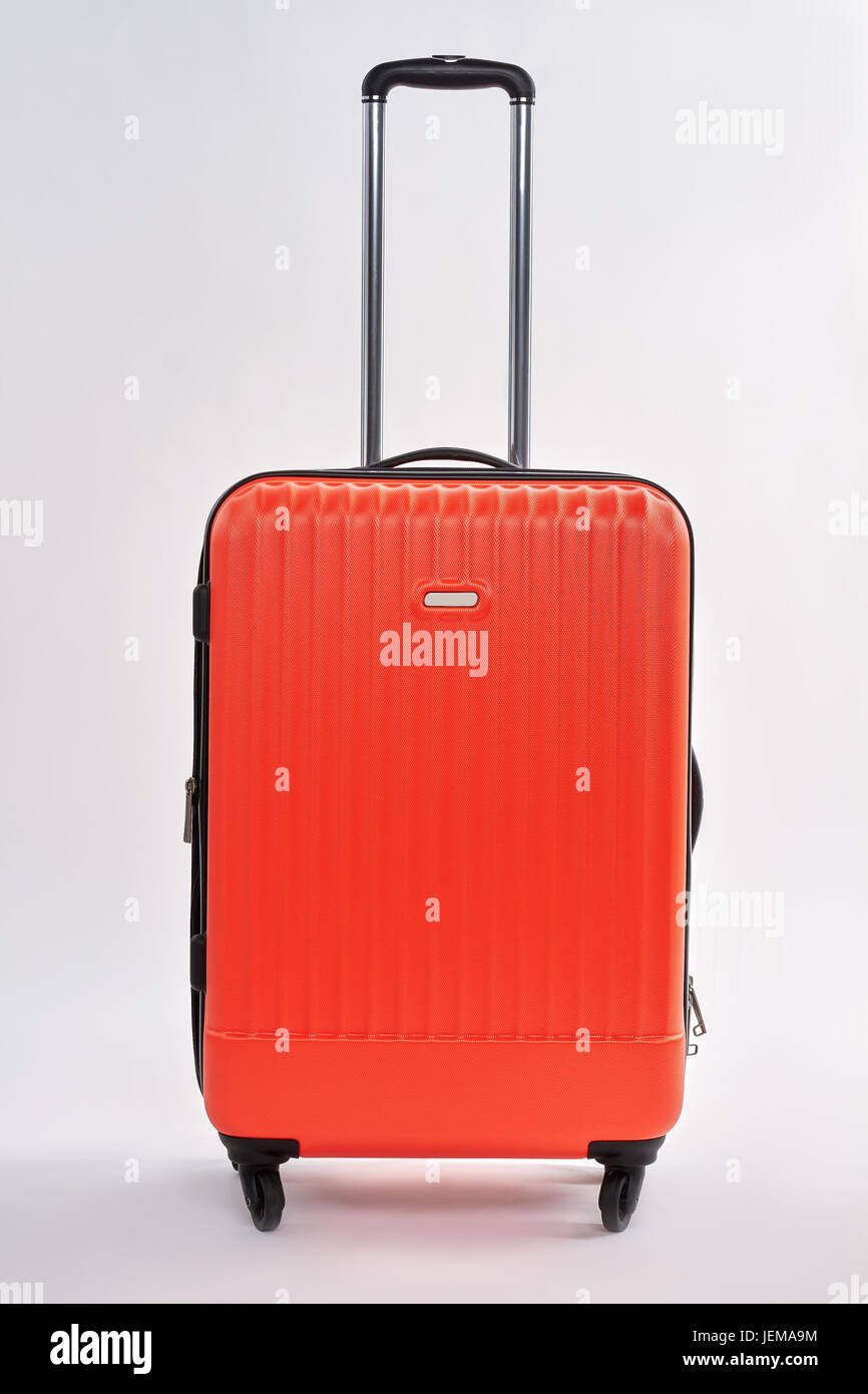 Red suitcase with metal handle. Large closed case, white background ...
