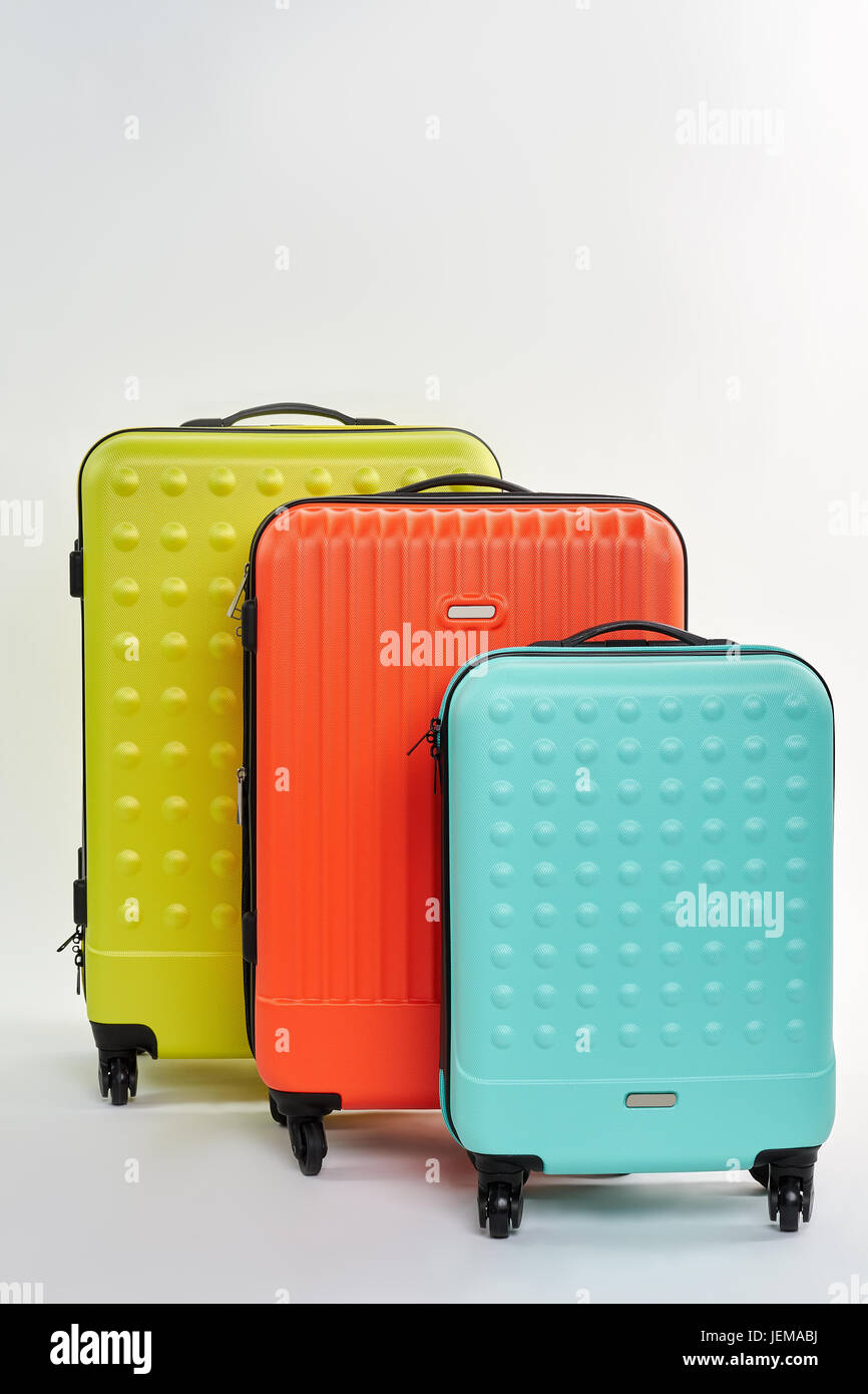 Set of different summer suitcases. Colorful luggages, front view Stock ...