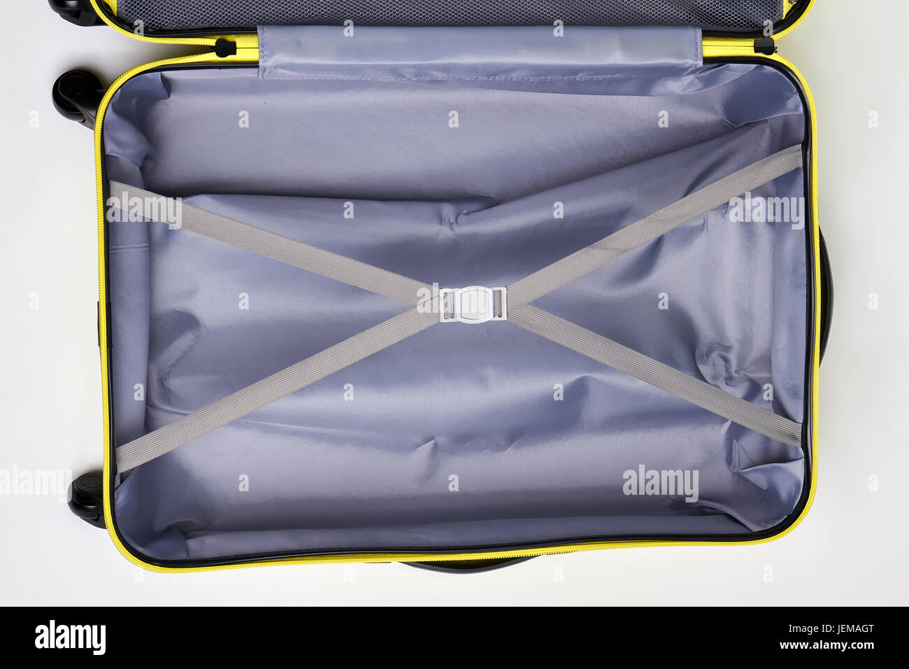 Empty luggage with crossed belts. Open suitcase for travel, top view ...