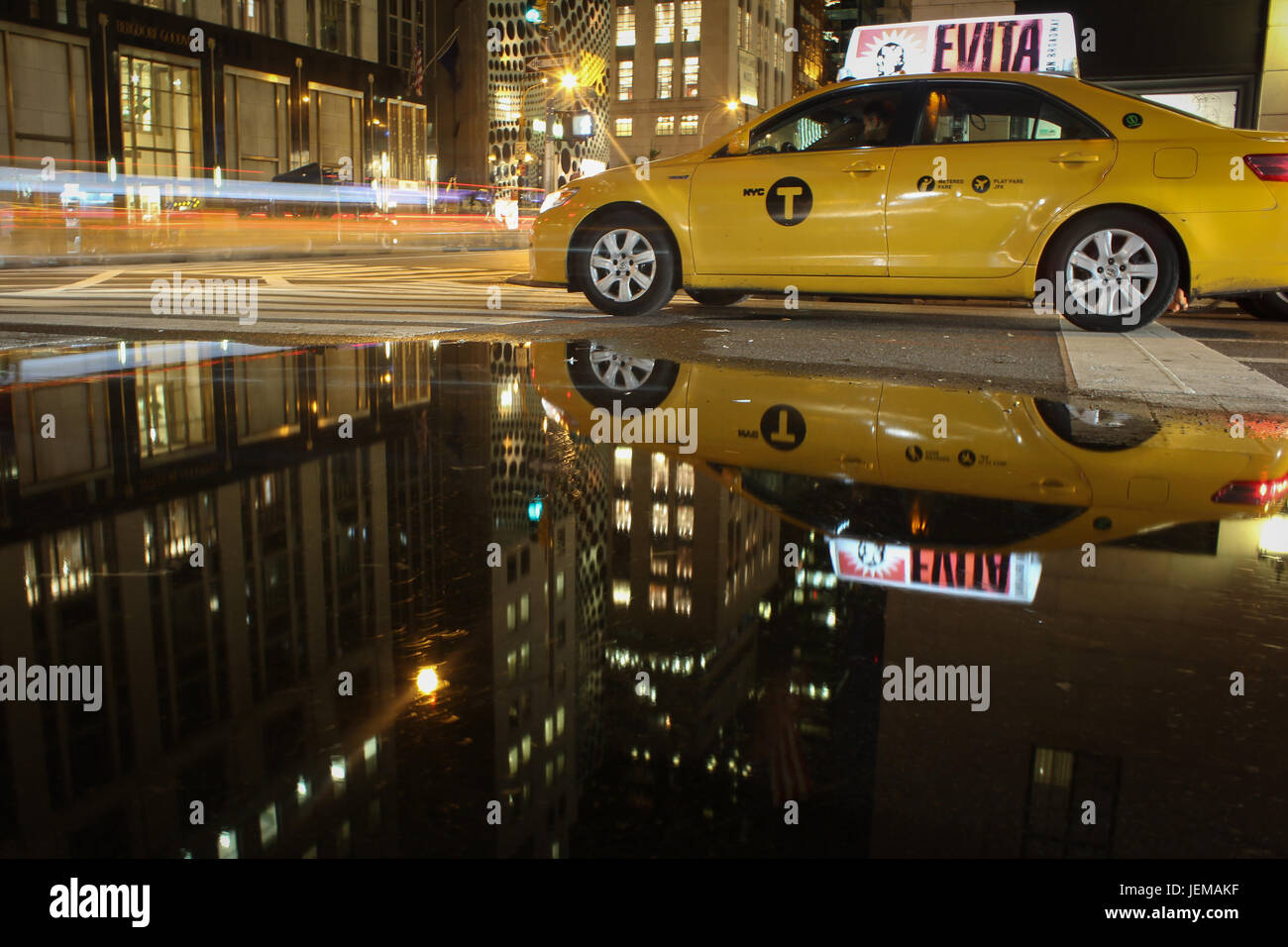 New York, a taxi reflection in a puddle Stock Photo - Alamy