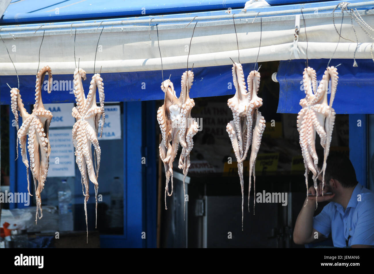 Octopus hanging in front of a restaurant of Piraeus (Greece Stock Photo ...