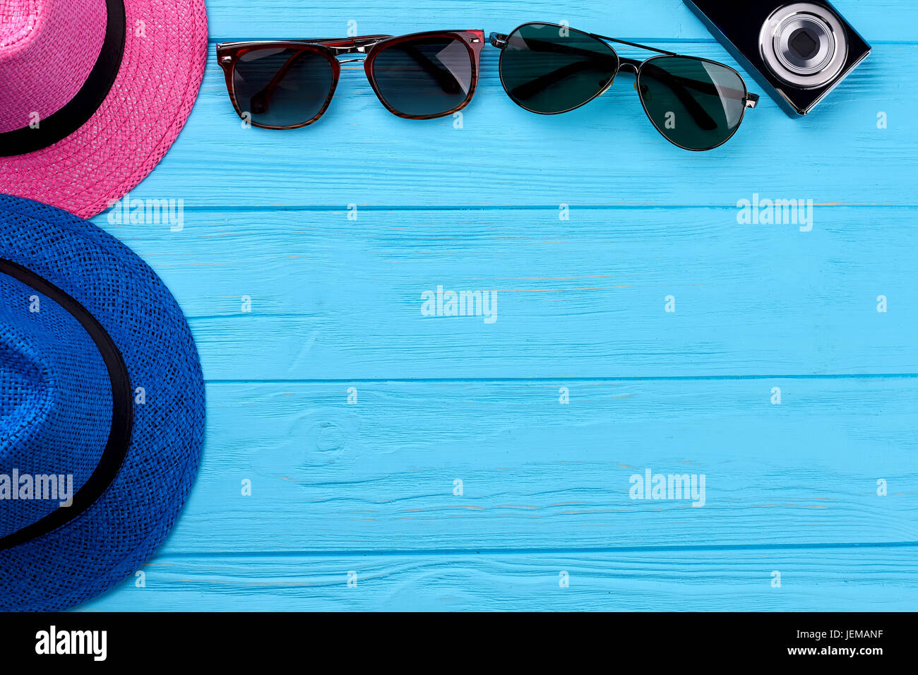 Pair of hats and glasses, camera. Sun protection accessories, photo ...