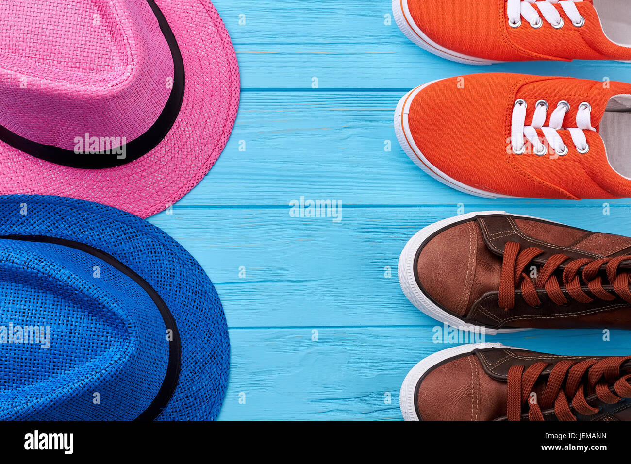 Pair of summer hats and shoes. Stylish sneakers for couple tourism ...