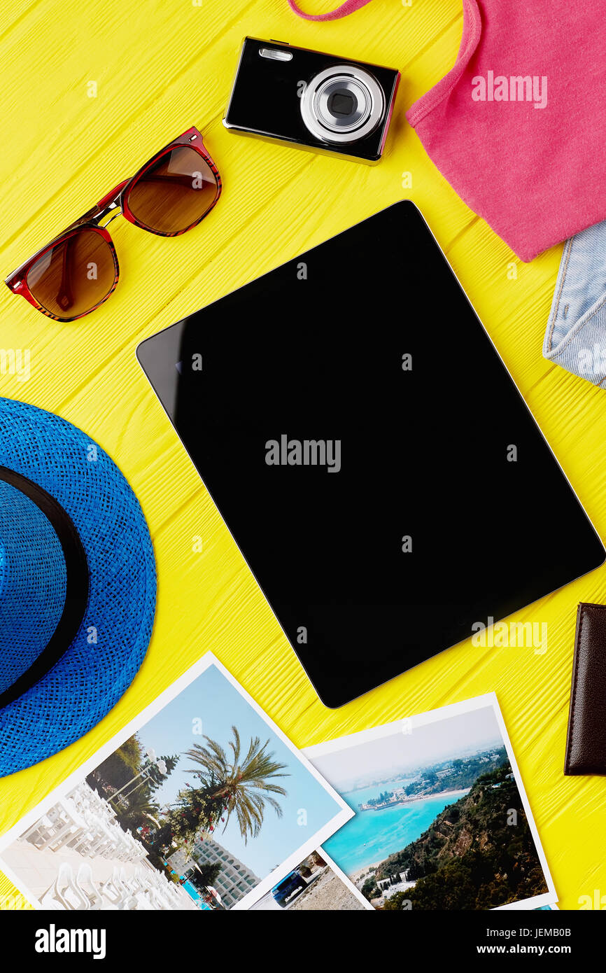 Modern electronic black gadget. Summer accessories on colorful ...