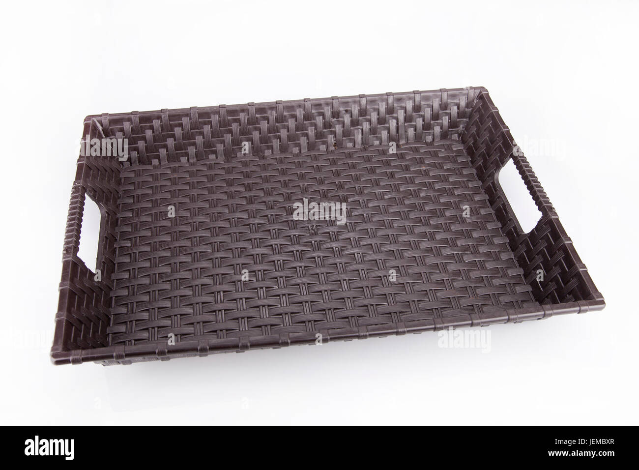 Empty brown plastic tray on a white surface. Plastic tray isolated on ...