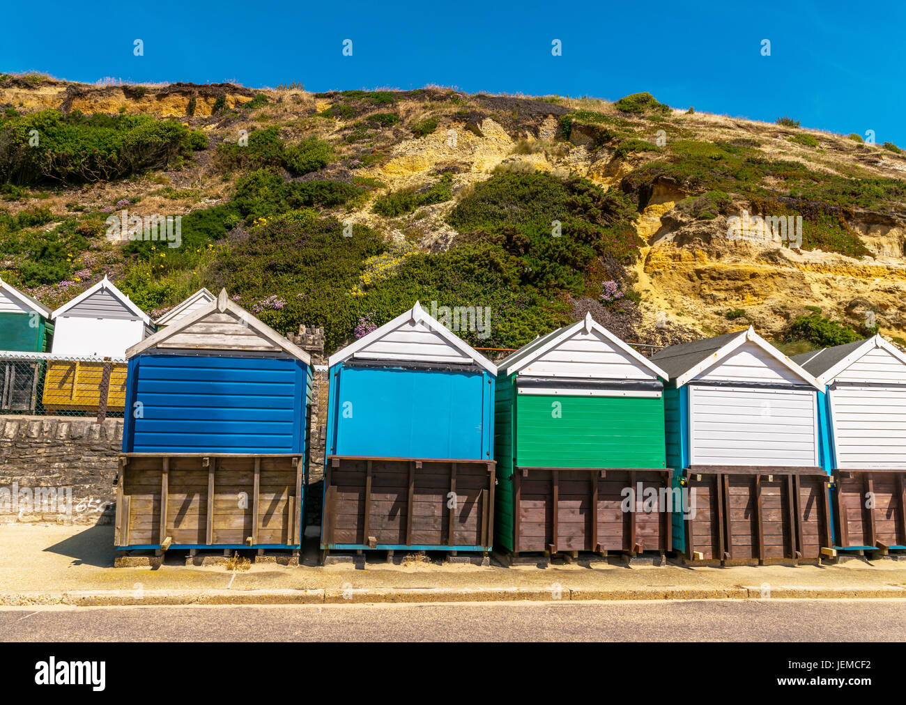 Colored houses on the beach, colorful door to summer cottages, seaside ...