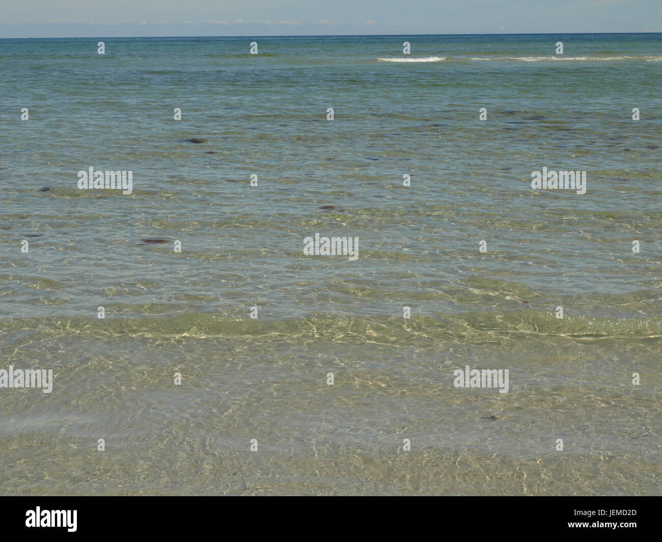 A photo of small waves on the beach in Cape Cod Stock Photo - Alamy