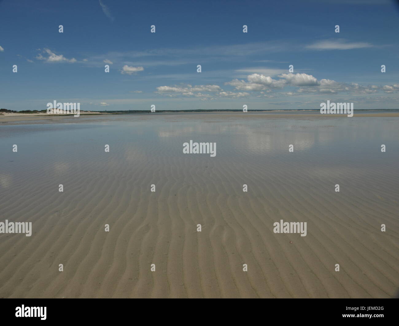 Still water on Cape Cod with the reflection of clouds Stock Photo - Alamy