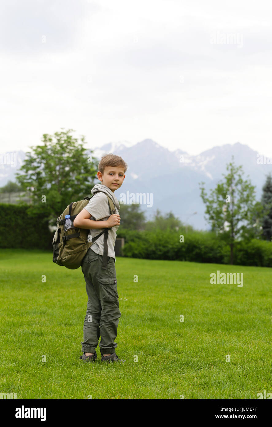 Boy with a backpack ready for adventure and travel Stock Photo - Alamy
