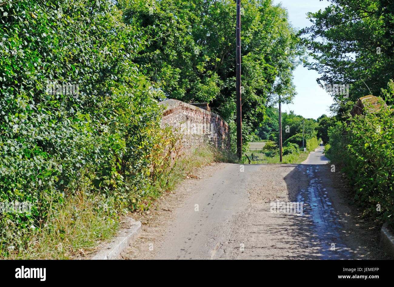 A narrow country road passing over the Grade Two listed Mayton Bridge ...