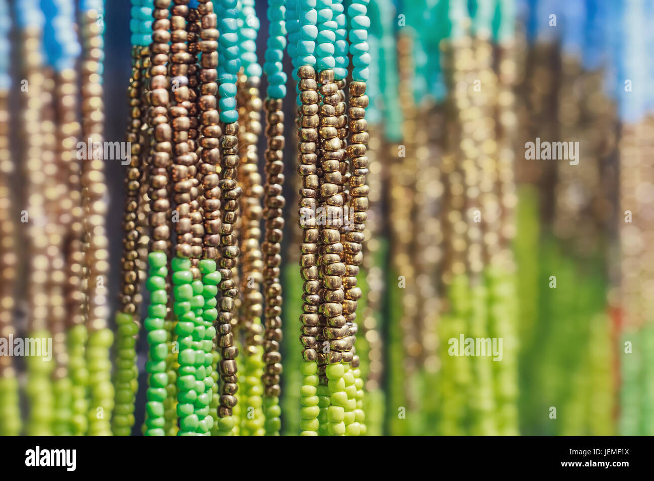 Strings with colored casual style beads Stock Photo - Alamy