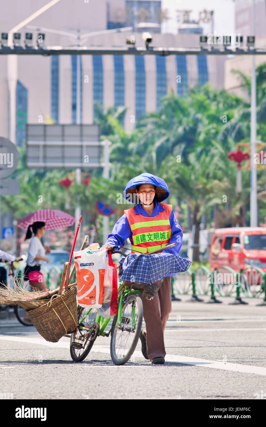 Female street sweeper hi-res stock photography and images - Alamy