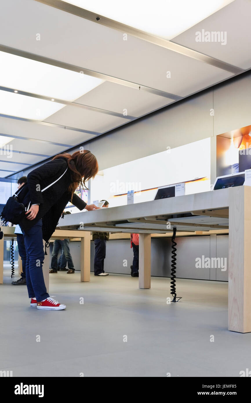 Interior of Apple flagship store, Beijing. Apple is an iconic brand in ...