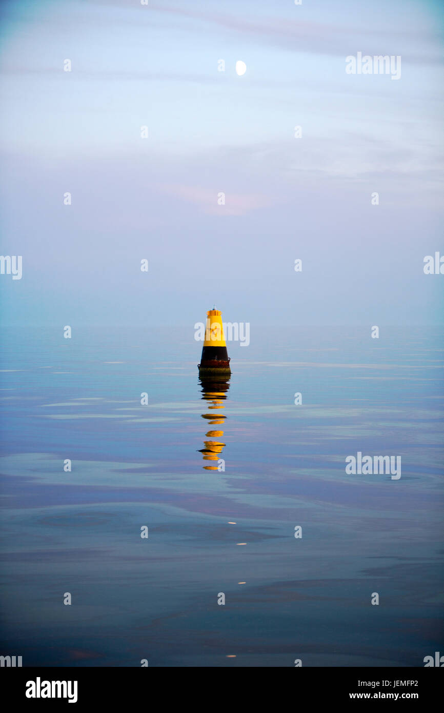 Yellow cone at sea Stock Photo - Alamy