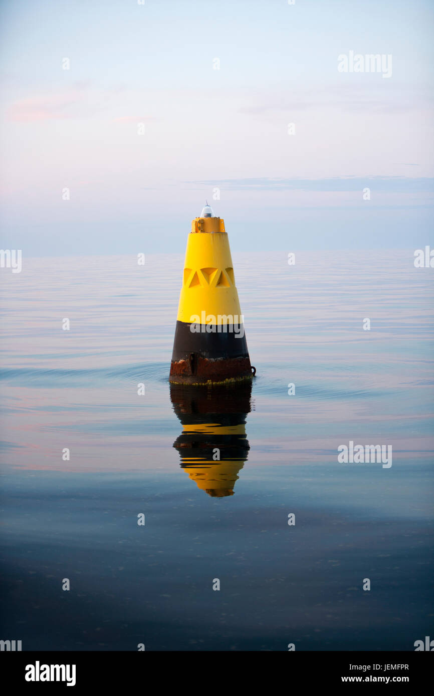 Yellow cone at sea Stock Photo - Alamy