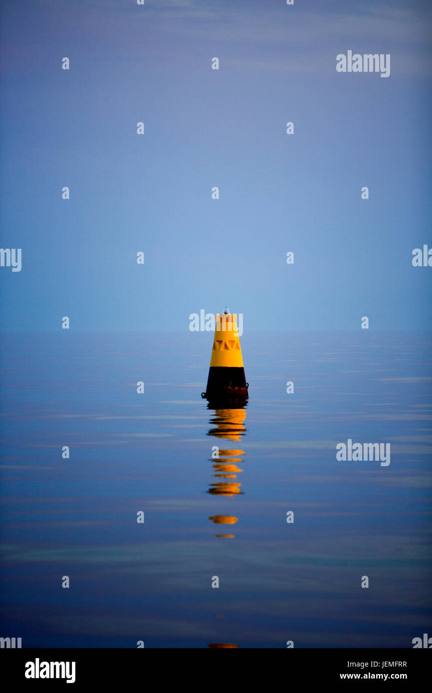Yellow cone at sea Stock Photo - Alamy