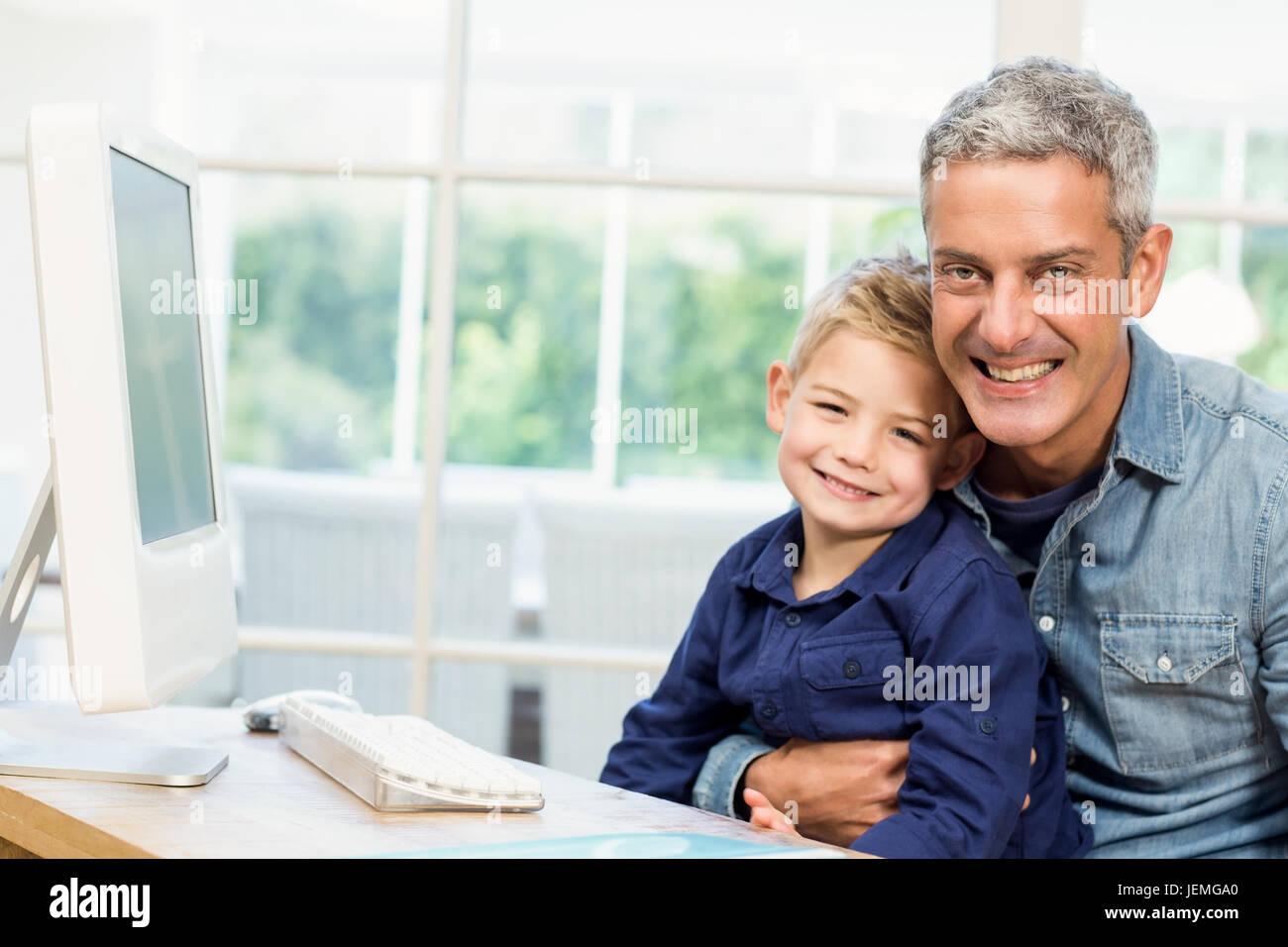 Father and son using the computer Stock Photo - Alamy